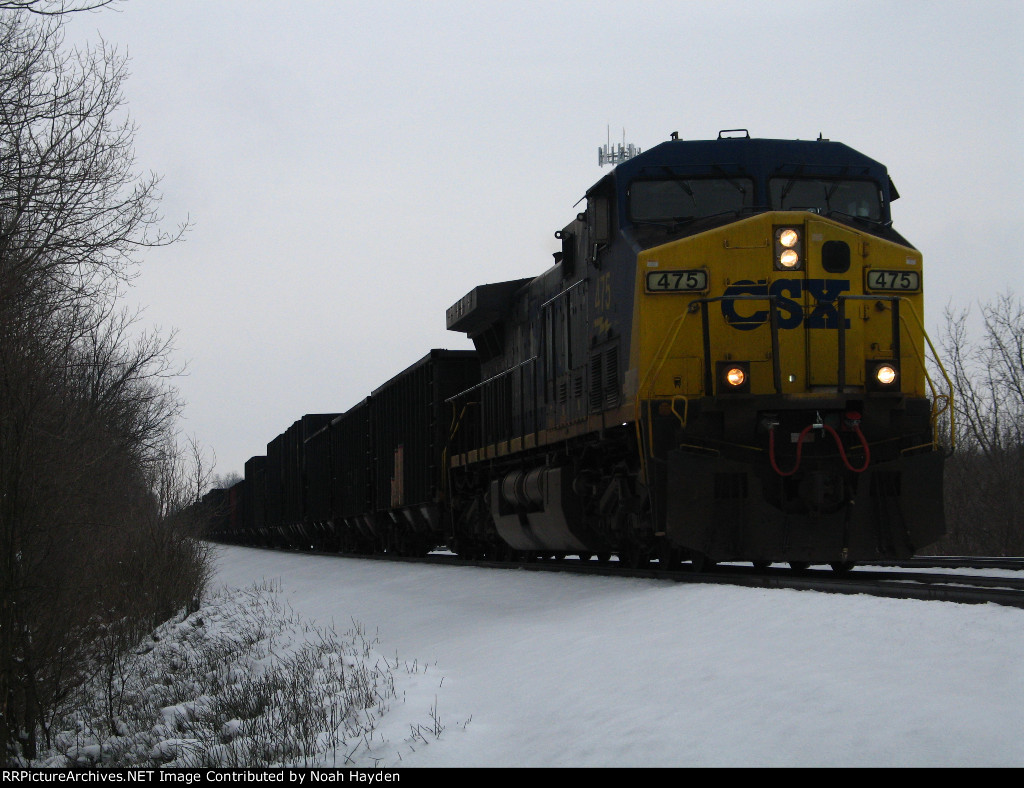 Solo unit CSX 475 leads a coke train thoug the snow